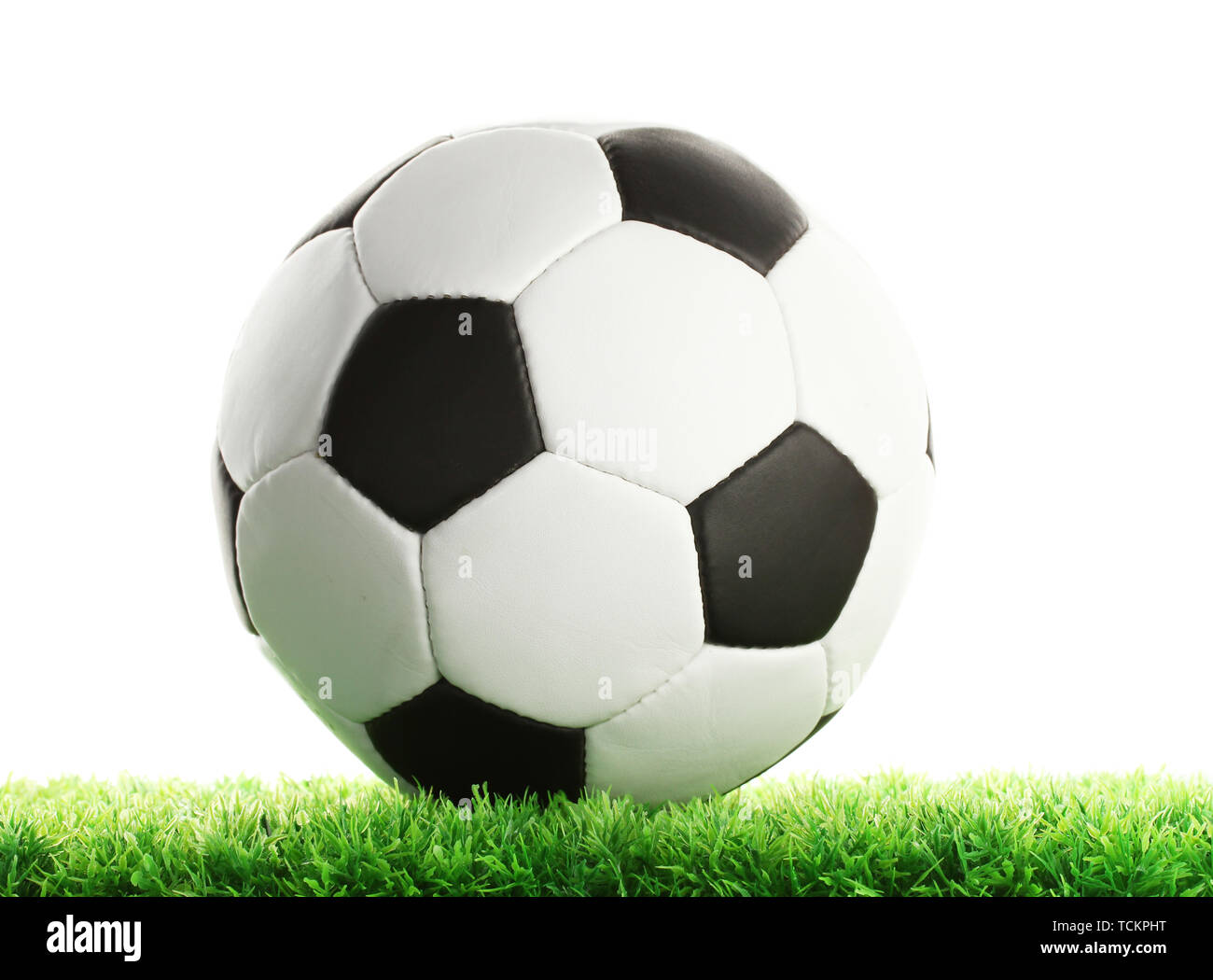 football ball on green grass, isolated on white Stock Photo - Alamy