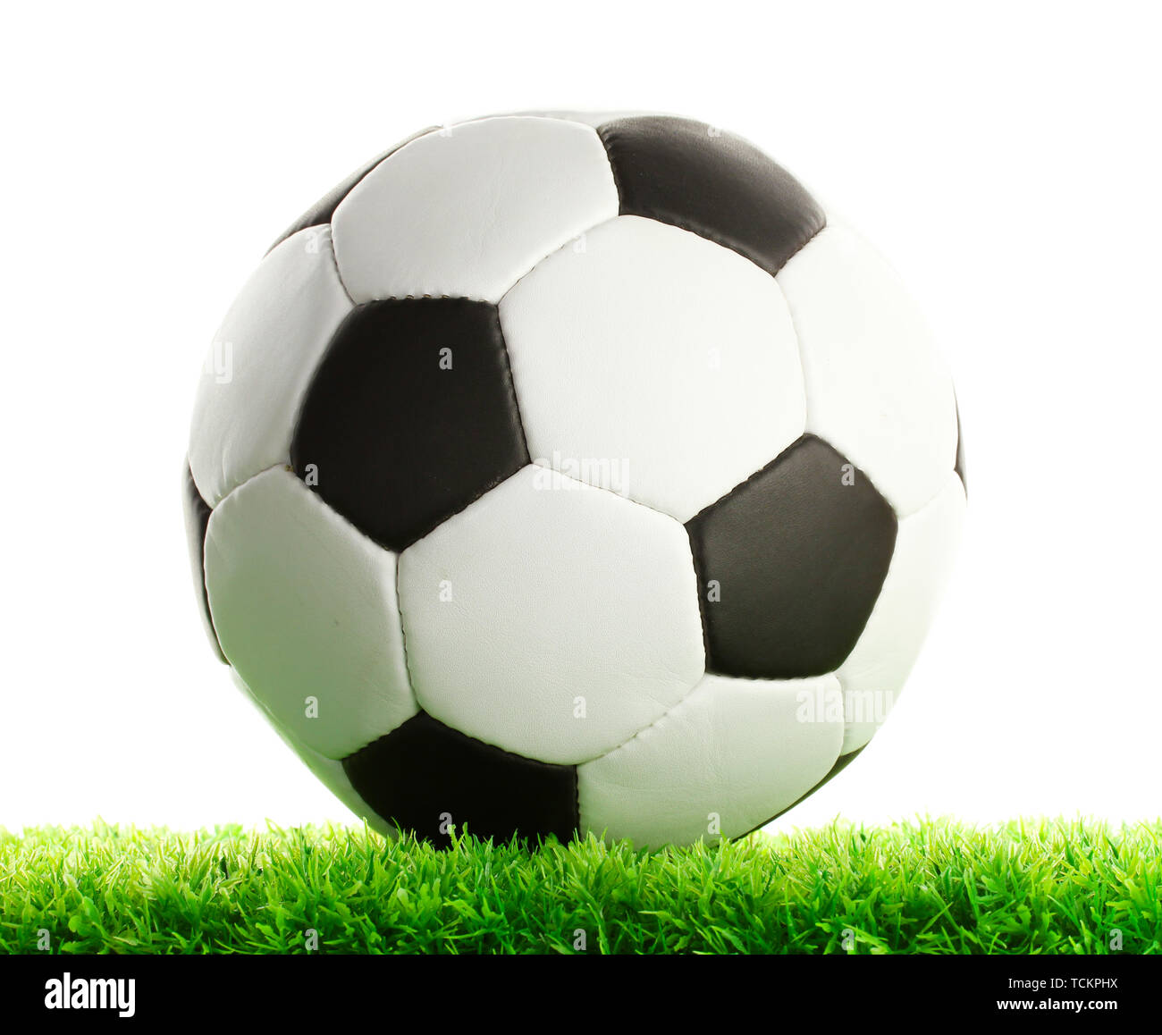 football ball on green grass, isolated on white Stock Photo - Alamy