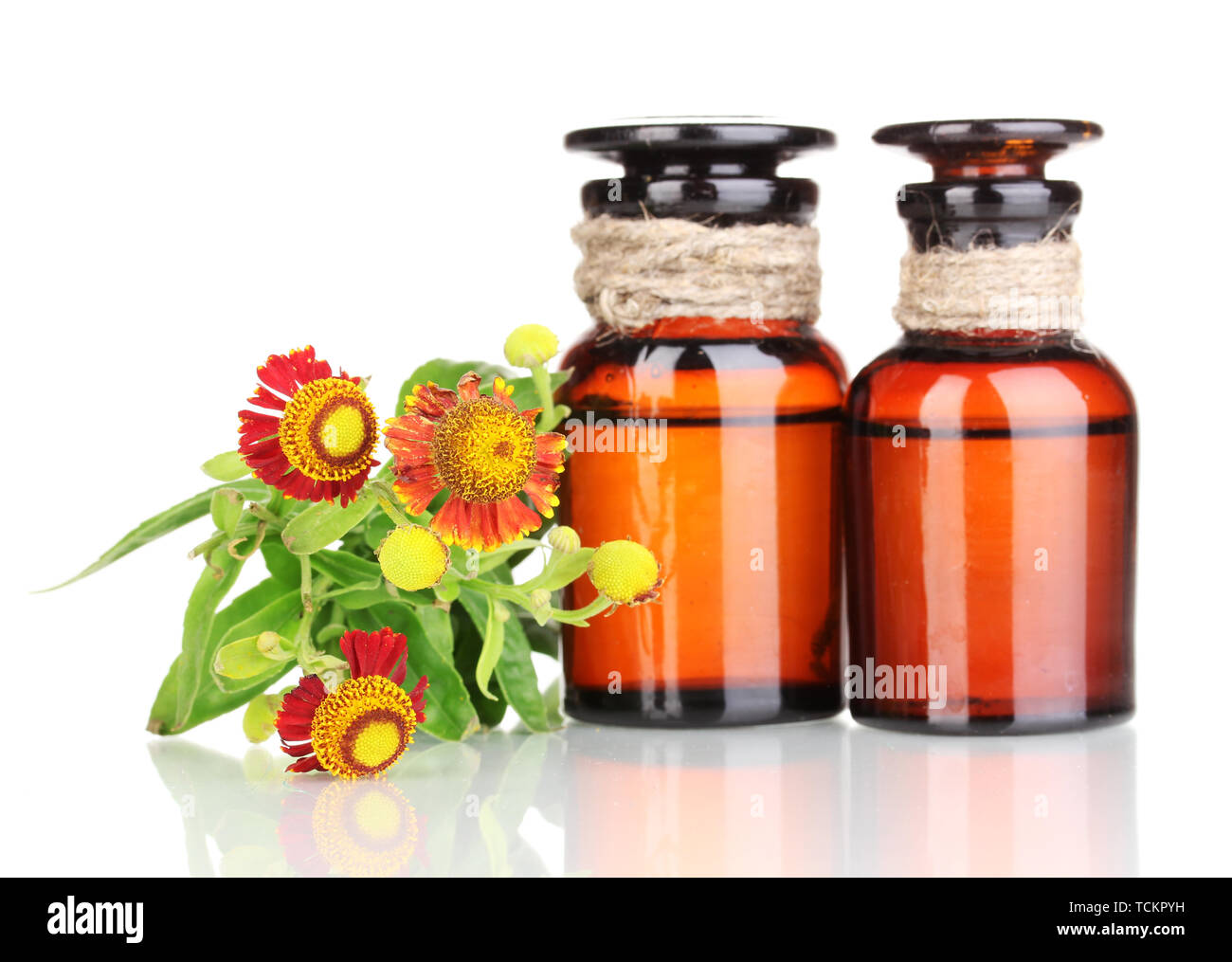 medicine bottles and flowers isolated on white Stock Photo - Alamy