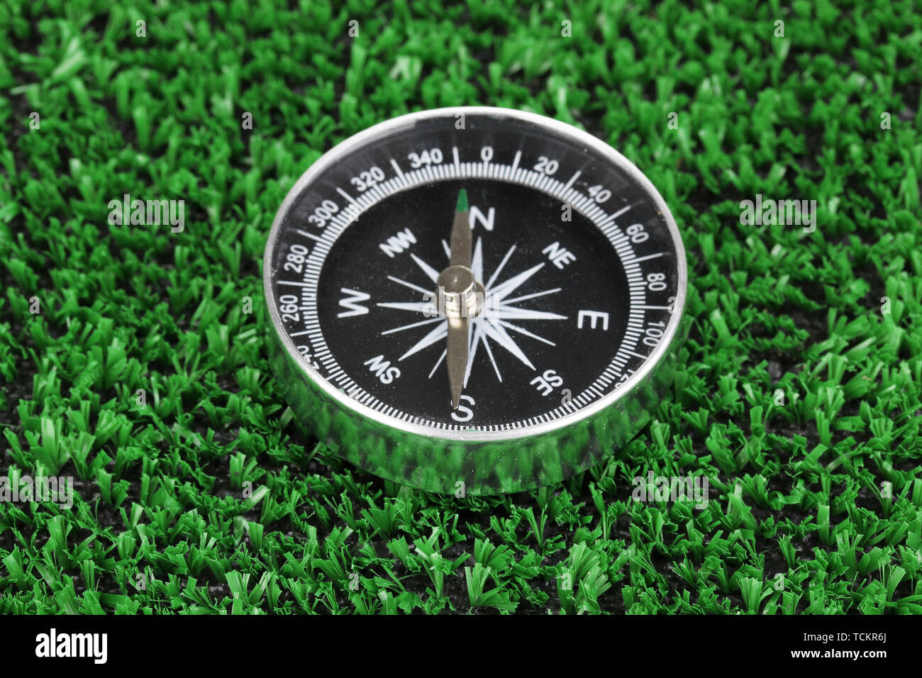 compass on green grass Stock Photo - Alamy