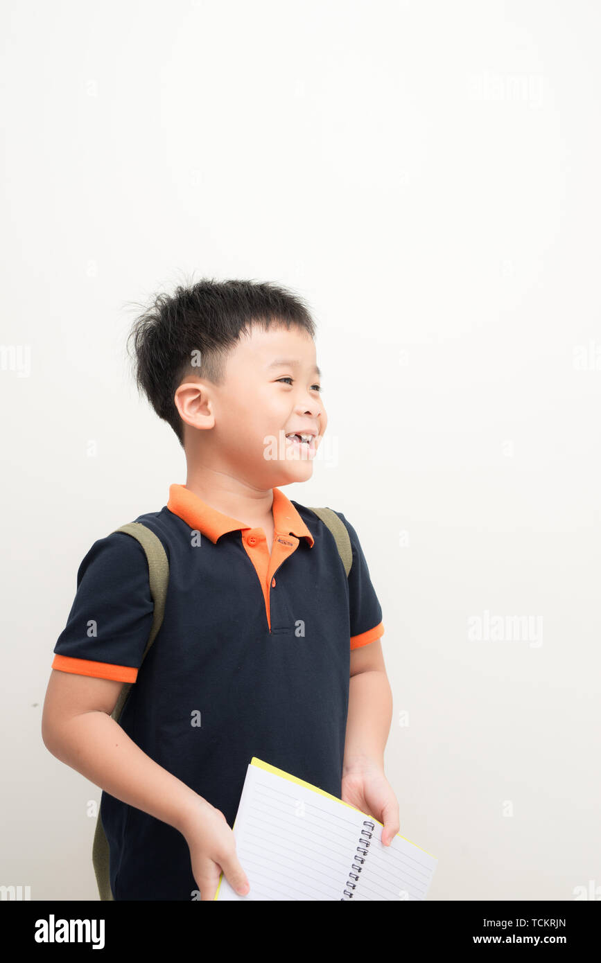 Happy little boy with book isolated on white background Stock Photo - Alamy