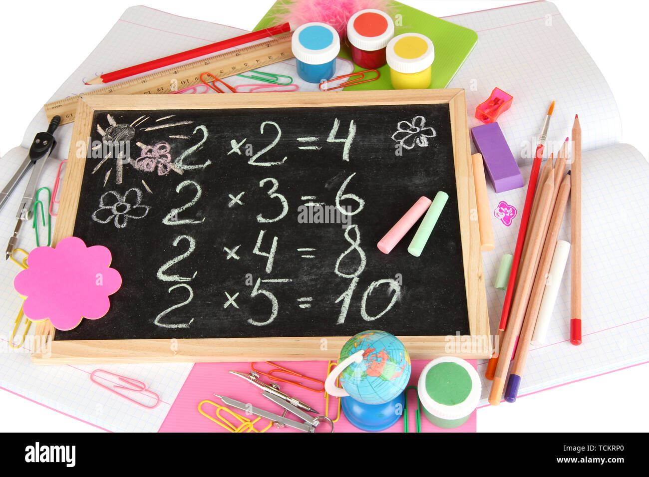 Small school desk with various school supplies close-up isolated on ...