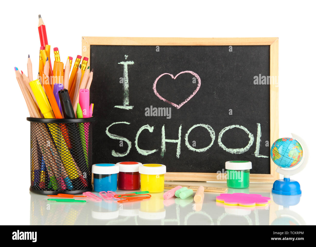 Small school desk with various school supplies close-up isolated on ...