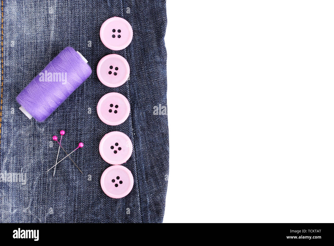 Colorful sewing buttons with thread on jeans isolated on white Stock ...