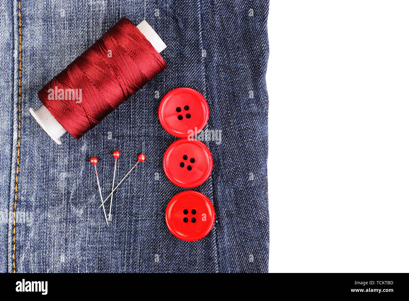 Colorful sewing buttons with thread on jeans isolated on white Stock ...