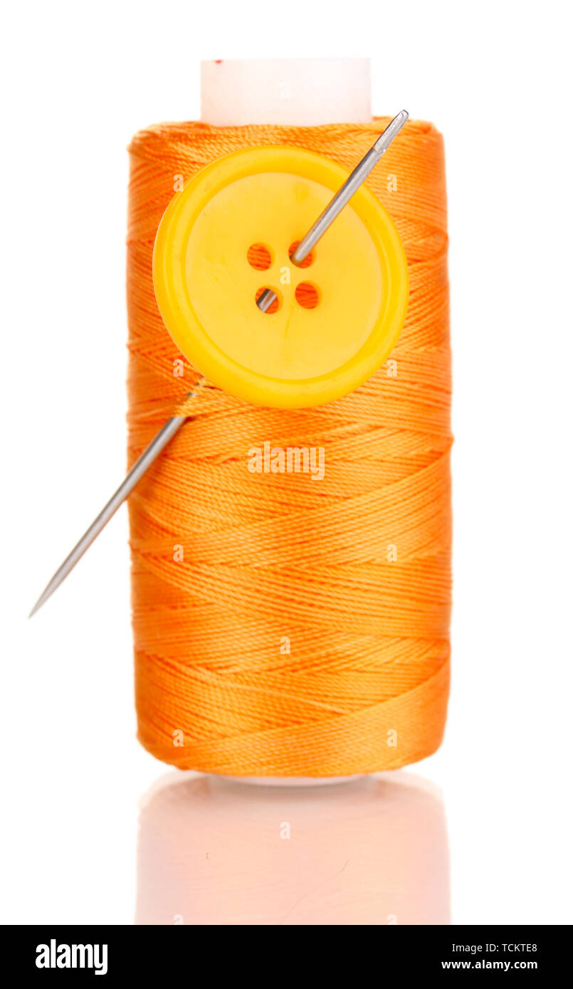 Yellow bobbin with needle and buttons isolated on white Stock Photo - Alamy