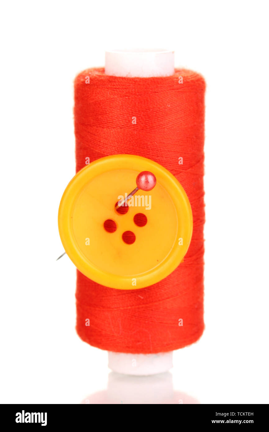Yellow bobbin with needle and buttons isolated on white Stock Photo - Alamy