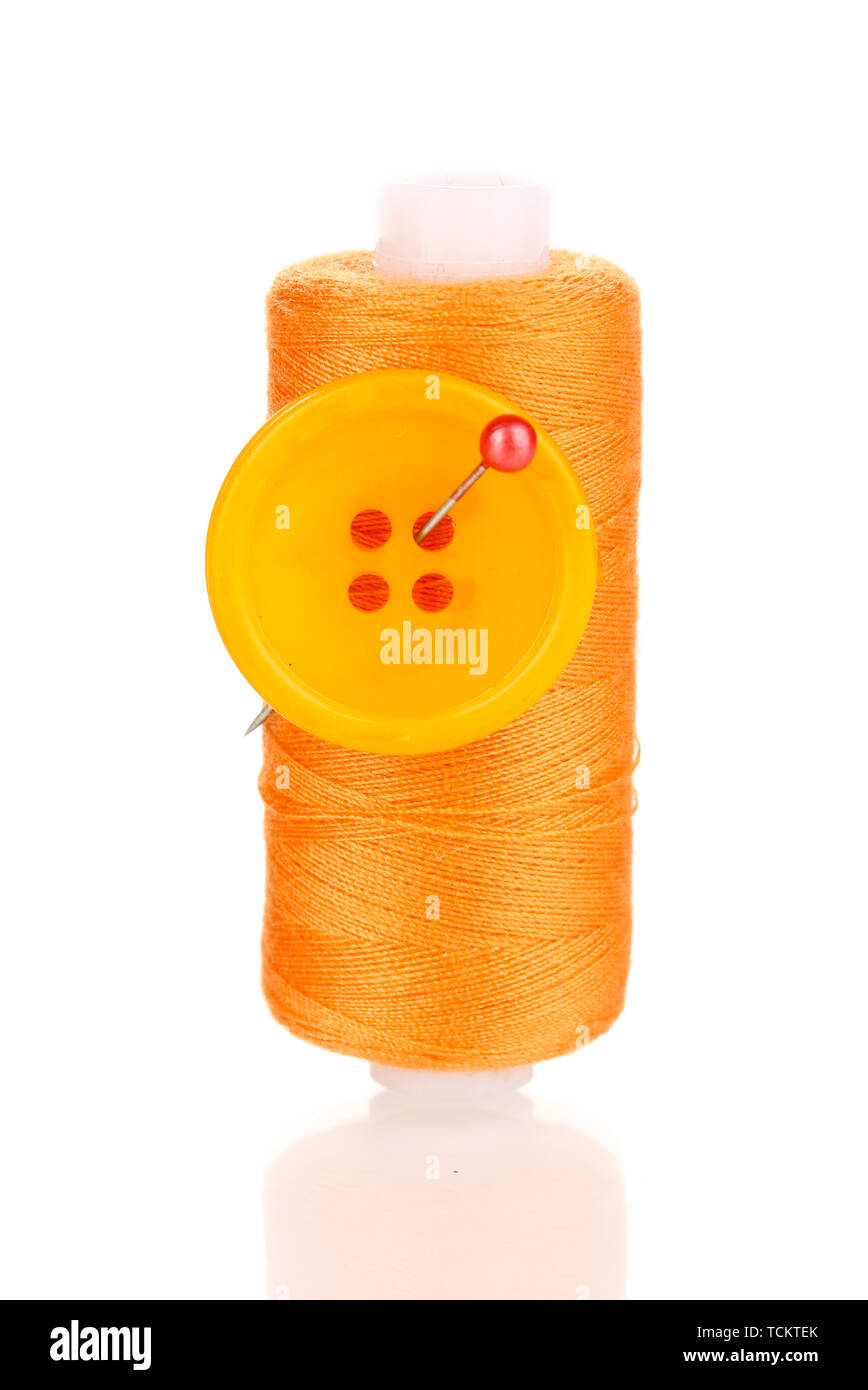 Yellow bobbin with needle and buttons isolated on white Stock Photo - Alamy