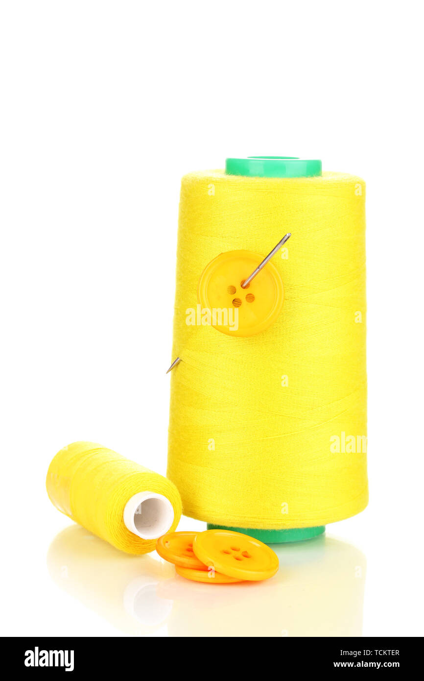 Yellow bobbin with needle and buttons isolated on white Stock Photo - Alamy