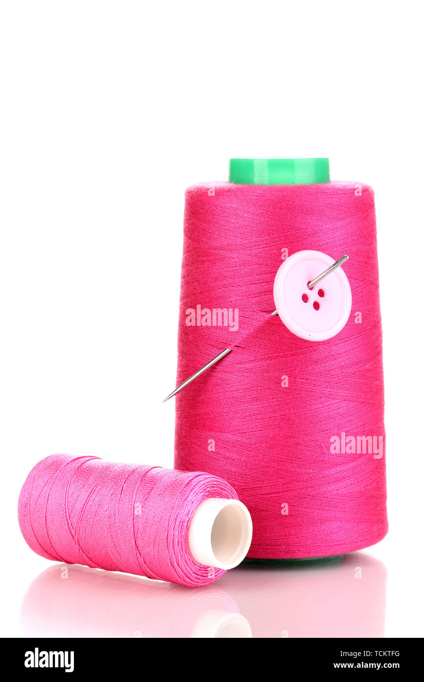 Pink bobbin with needle and buttons isolated on white Stock Photo - Alamy