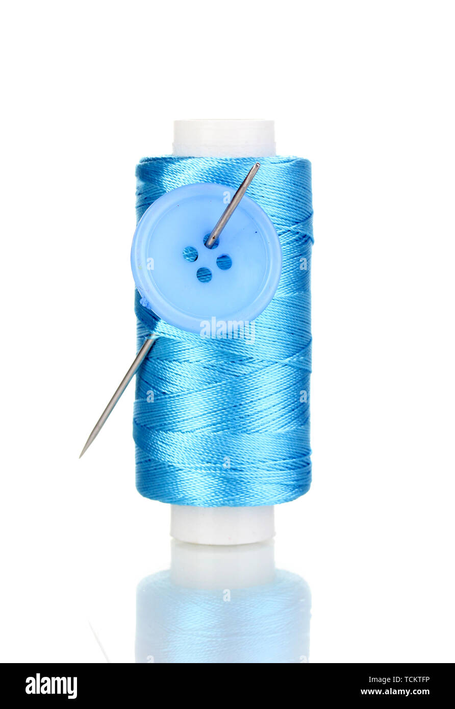 Blue bobbin with needle and buttons isolated on white Stock Photo - Alamy