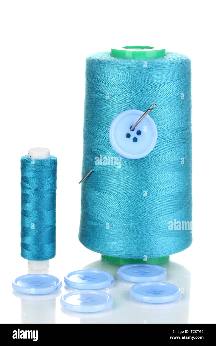 Blue bobbin with needle and buttons isolated on white Stock Photo - Alamy
