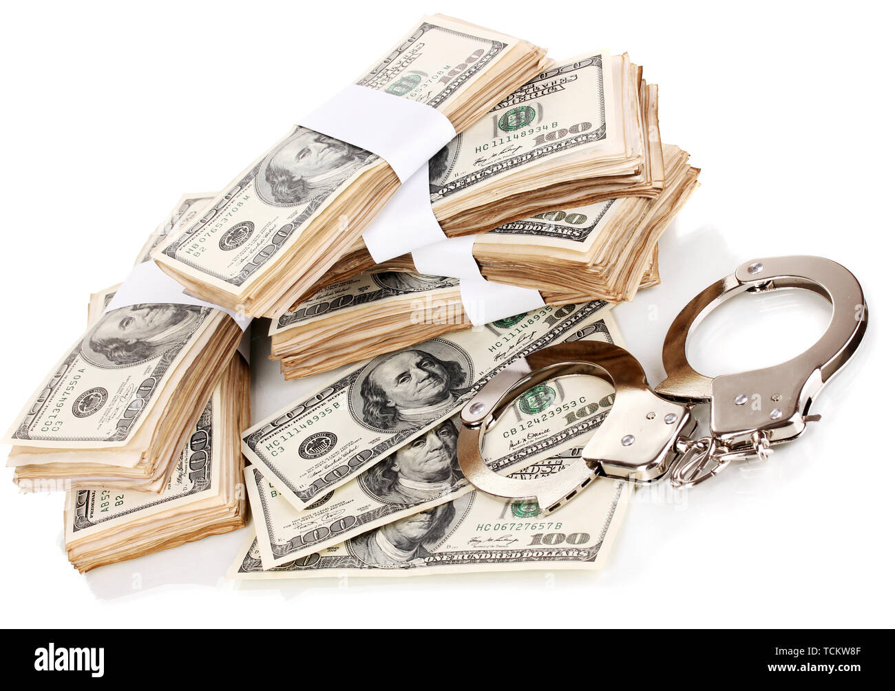 Handcuffs and packs of dollars isolated on white Stock Photo - Alamy