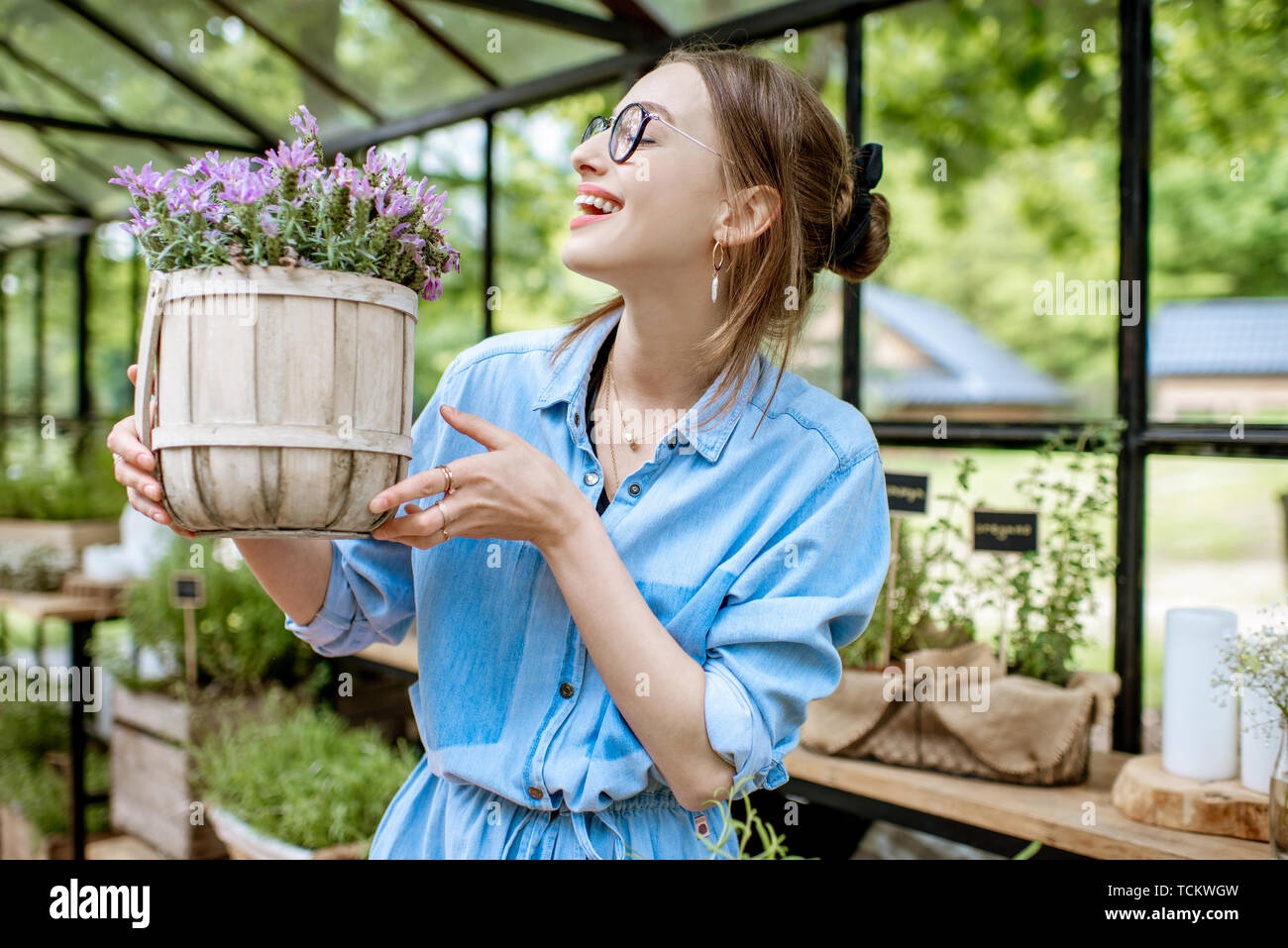 Woman carrying flower hi-res stock photography and images - Alamy