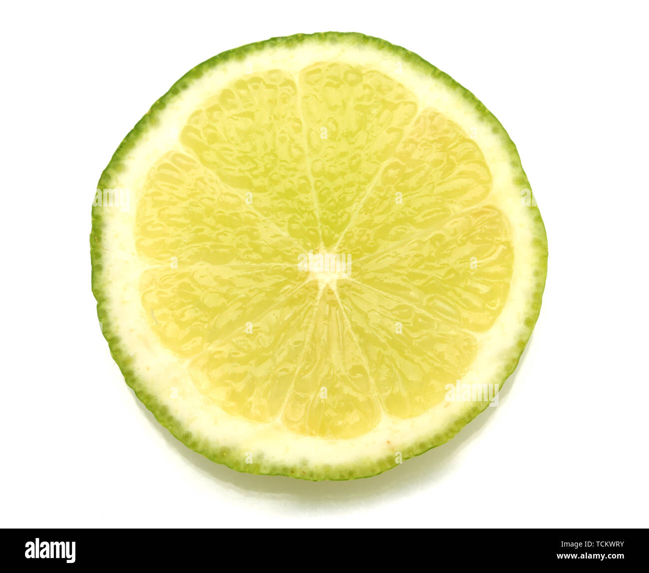 Slice of lime isolated on white Stock Photo - Alamy