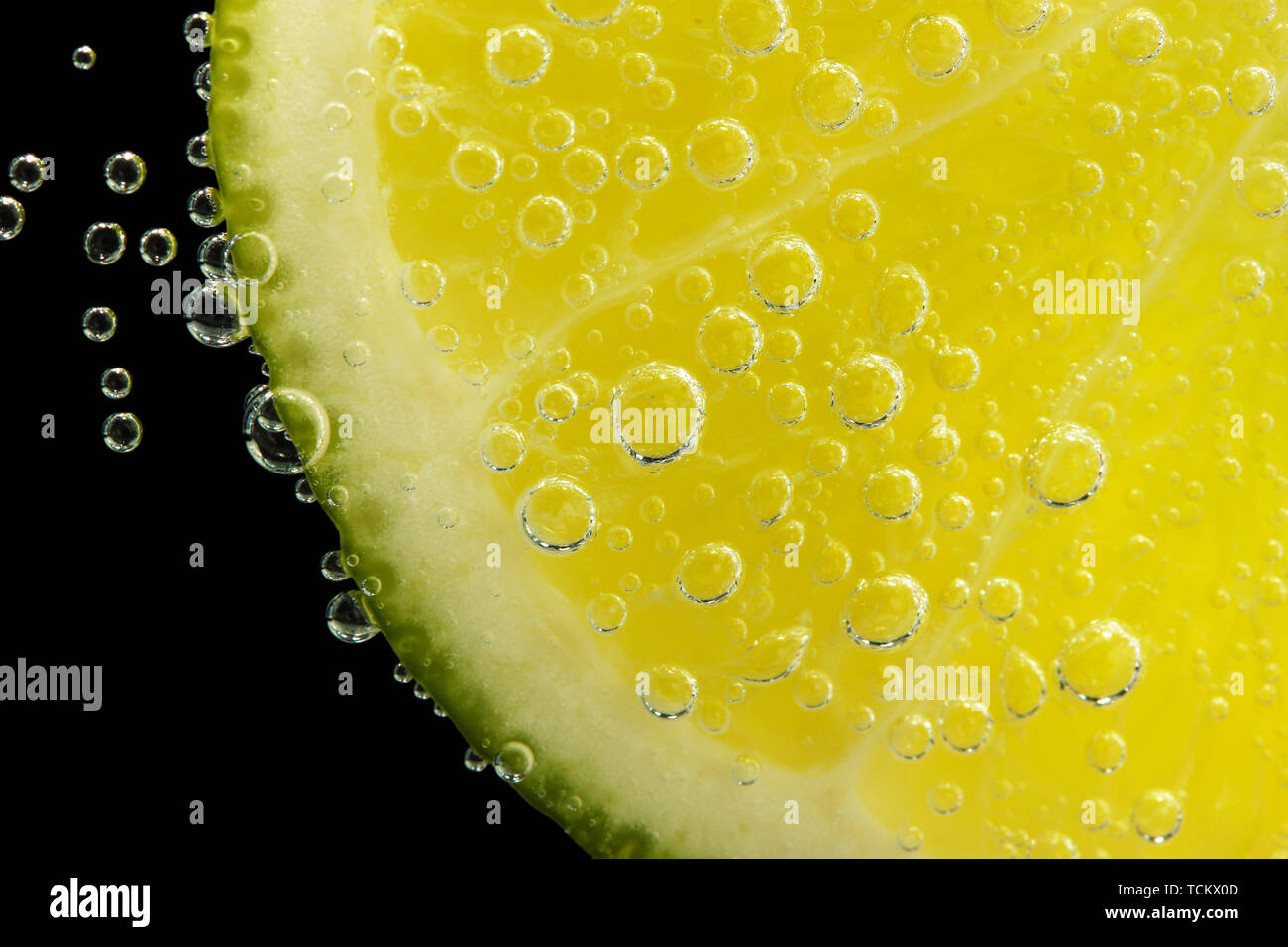 slice of lime in the water with bubbles, on black background Stock ...
