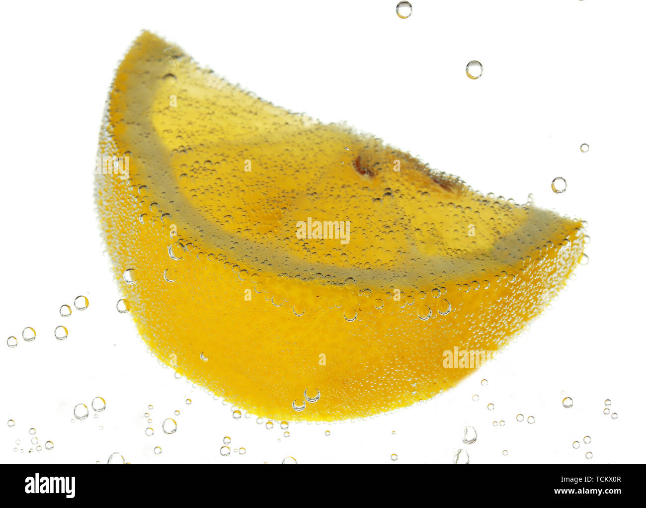 slice of lemon in the water with bubbles, isolated on white Stock Photo ...