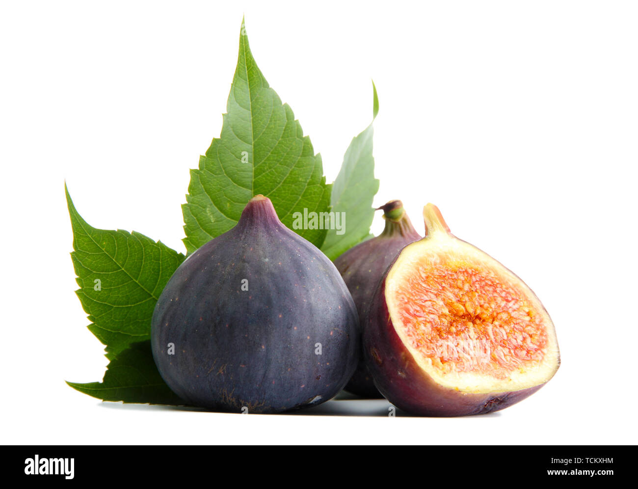 Ripe sweet figs with leaves isolated on white Stock Photo - Alamy