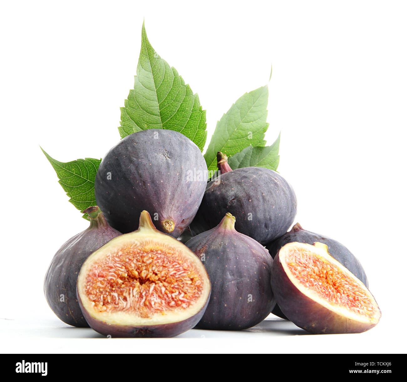 Ripe sweet figs with leaves isolated on white Stock Photo - Alamy