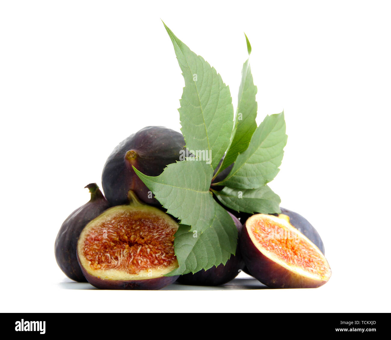 Ripe sweet figs with leaves isolated on white Stock Photo - Alamy