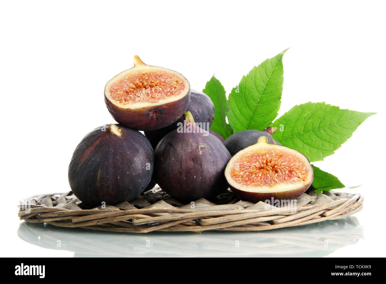 Ripe sweet figs with leaves isolated on white Stock Photo - Alamy