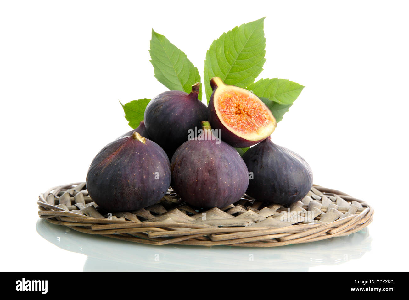 Ripe sweet figs with leaves isolated on white Stock Photo - Alamy