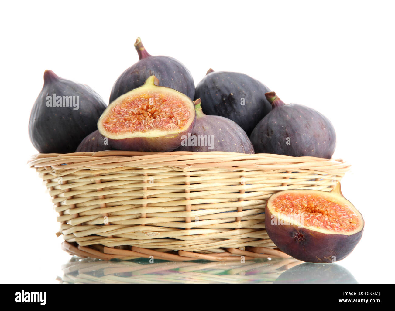 Ripe sweet figs in basket isolated on white Stock Photo - Alamy