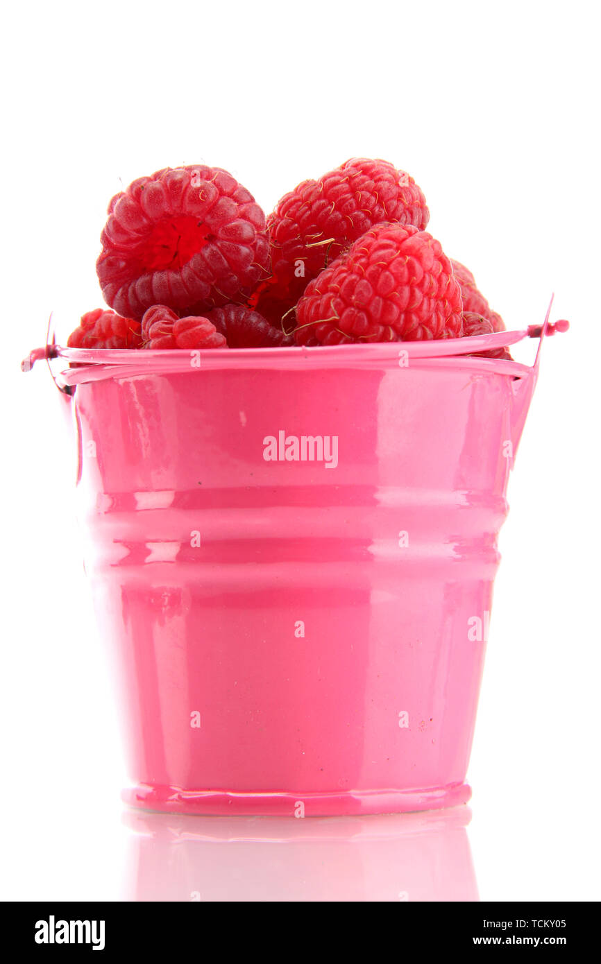 beautiful raspberries in bucket isolated on white Stock Photo - Alamy