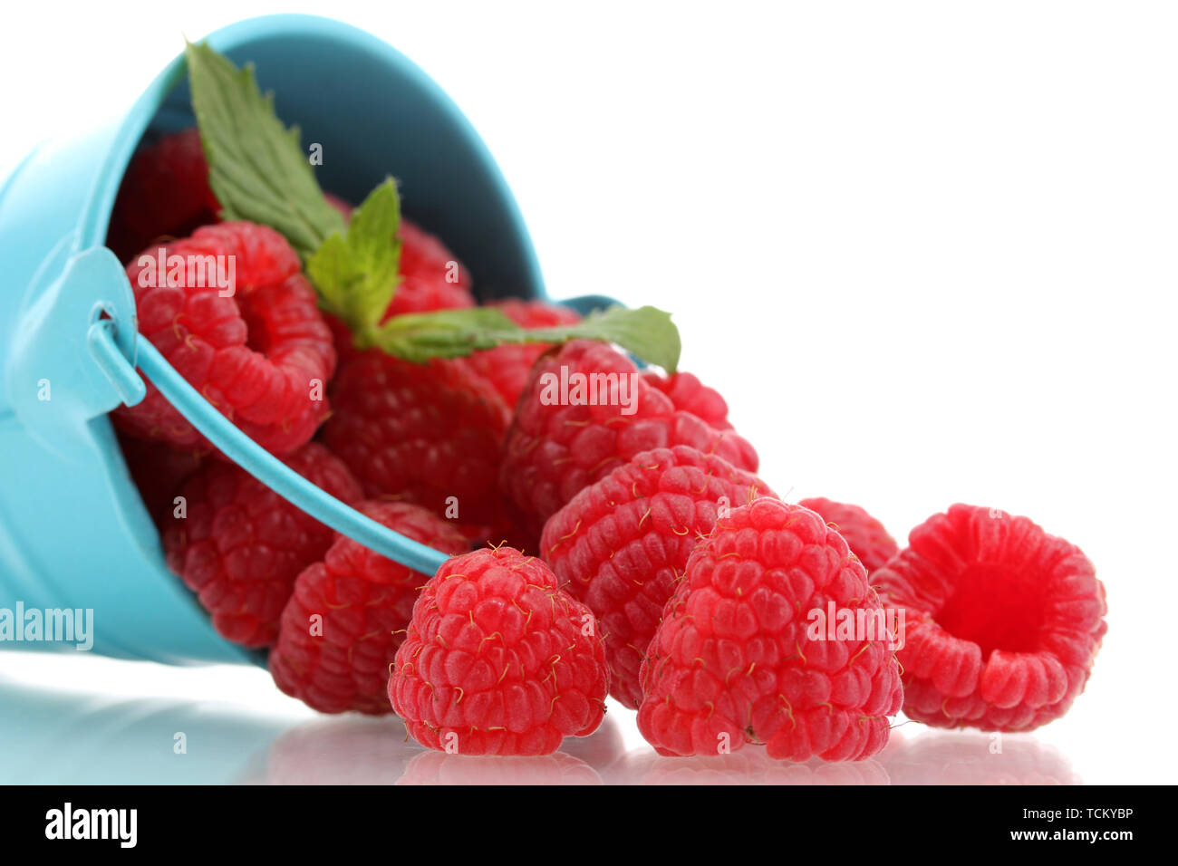 beautiful raspberries in bucket isolated on white Stock Photo - Alamy