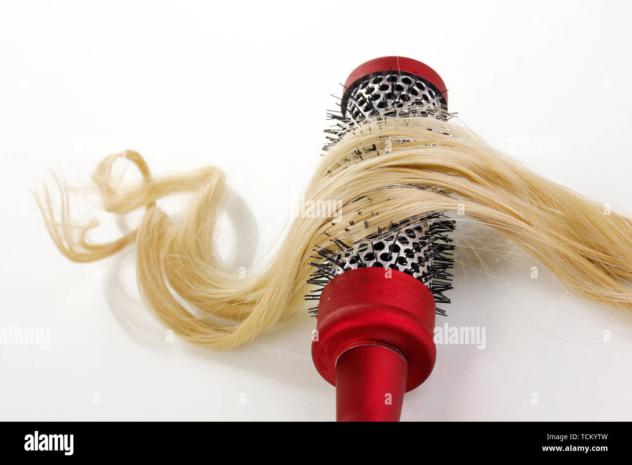 Blond curls brushing comb isolated on white Stock Photo - Alamy