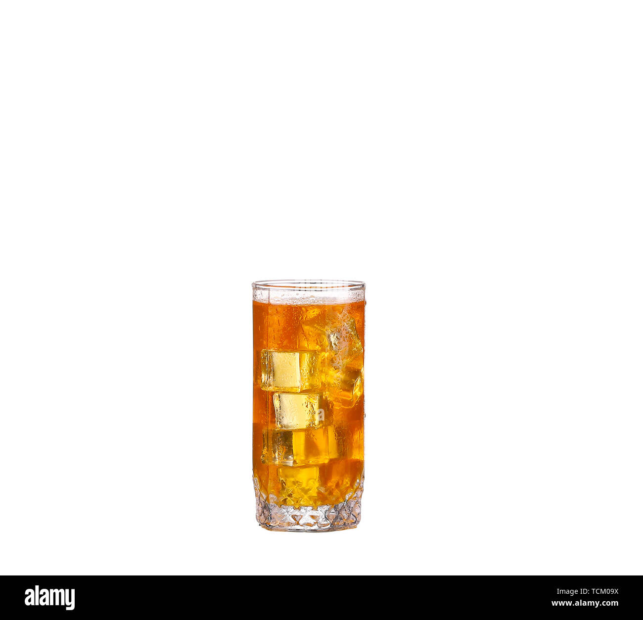 Cold glass of iced tea with ice cubes, isolated on white background ...