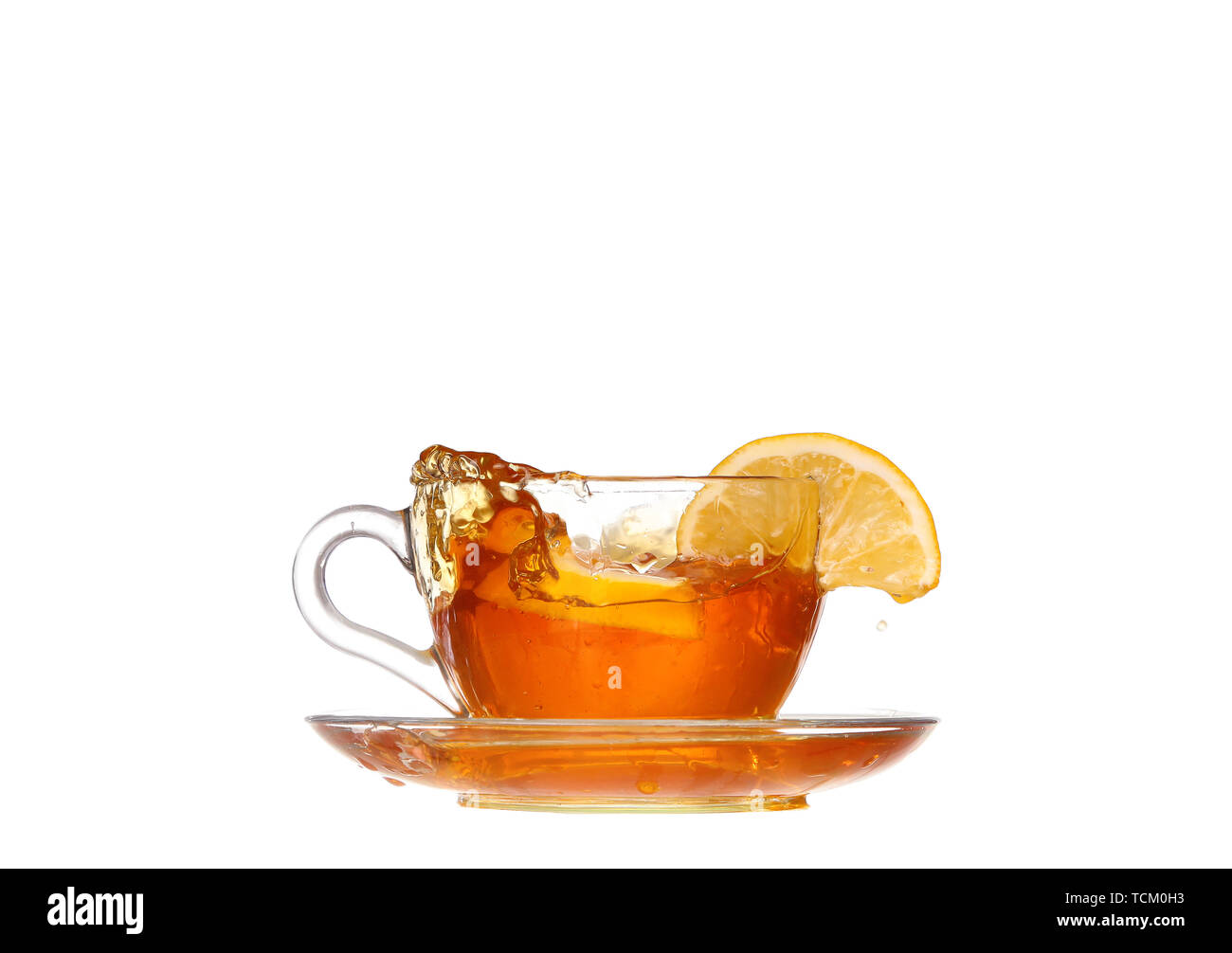 lemon tea with a splash on a white background Stock Photo - Alamy