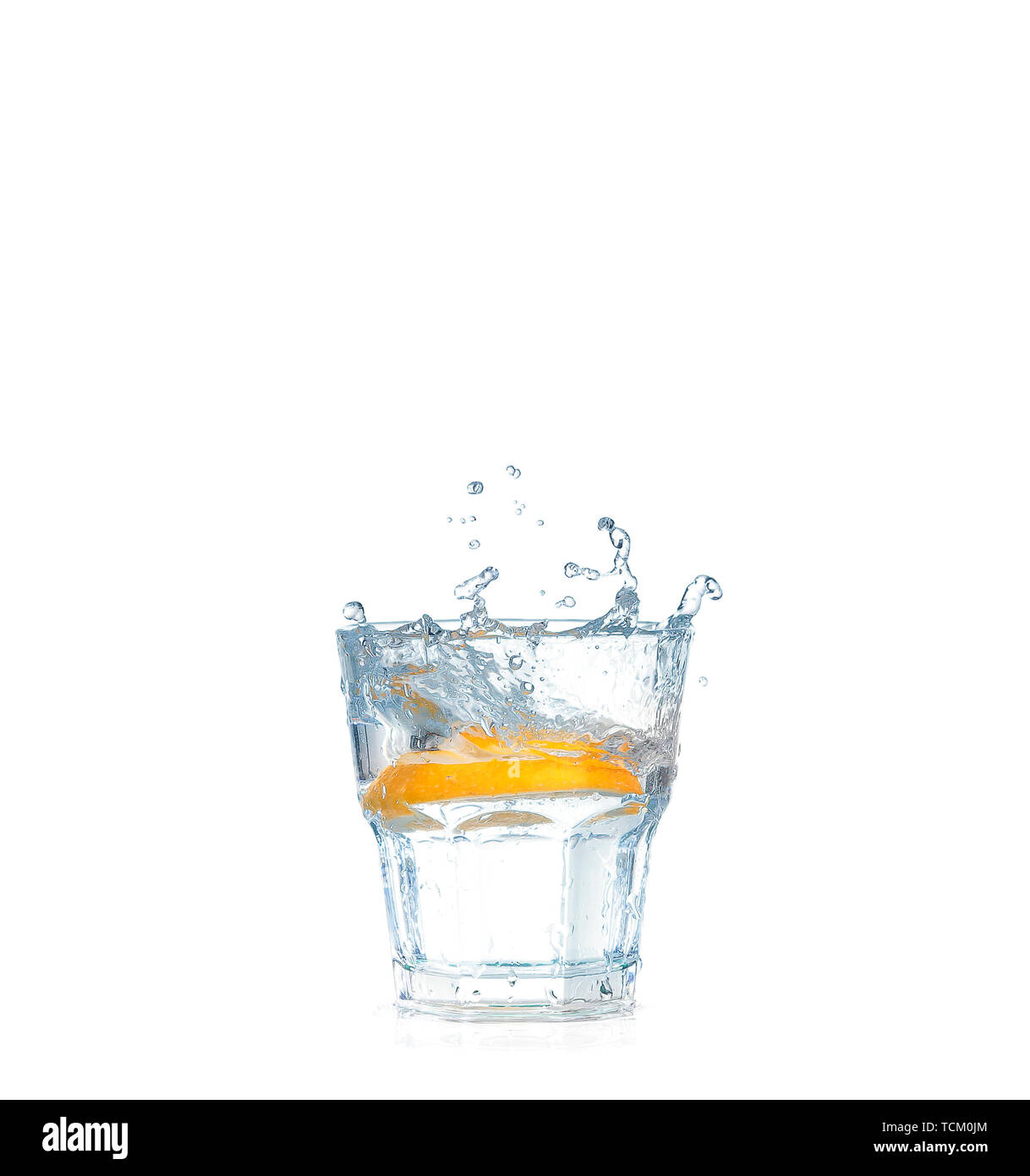 Ice cubes splashing into glass of water, isolated on white Stock Photo ...