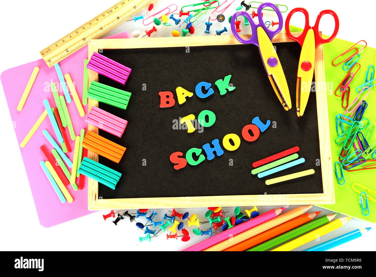 Small chalkboard with school supplies on white background. Back to ...