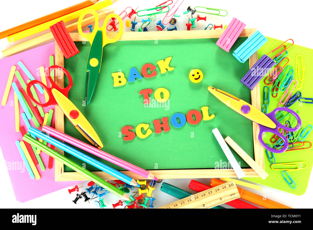 Small chalkboard with school supplies on white background. Back to ...