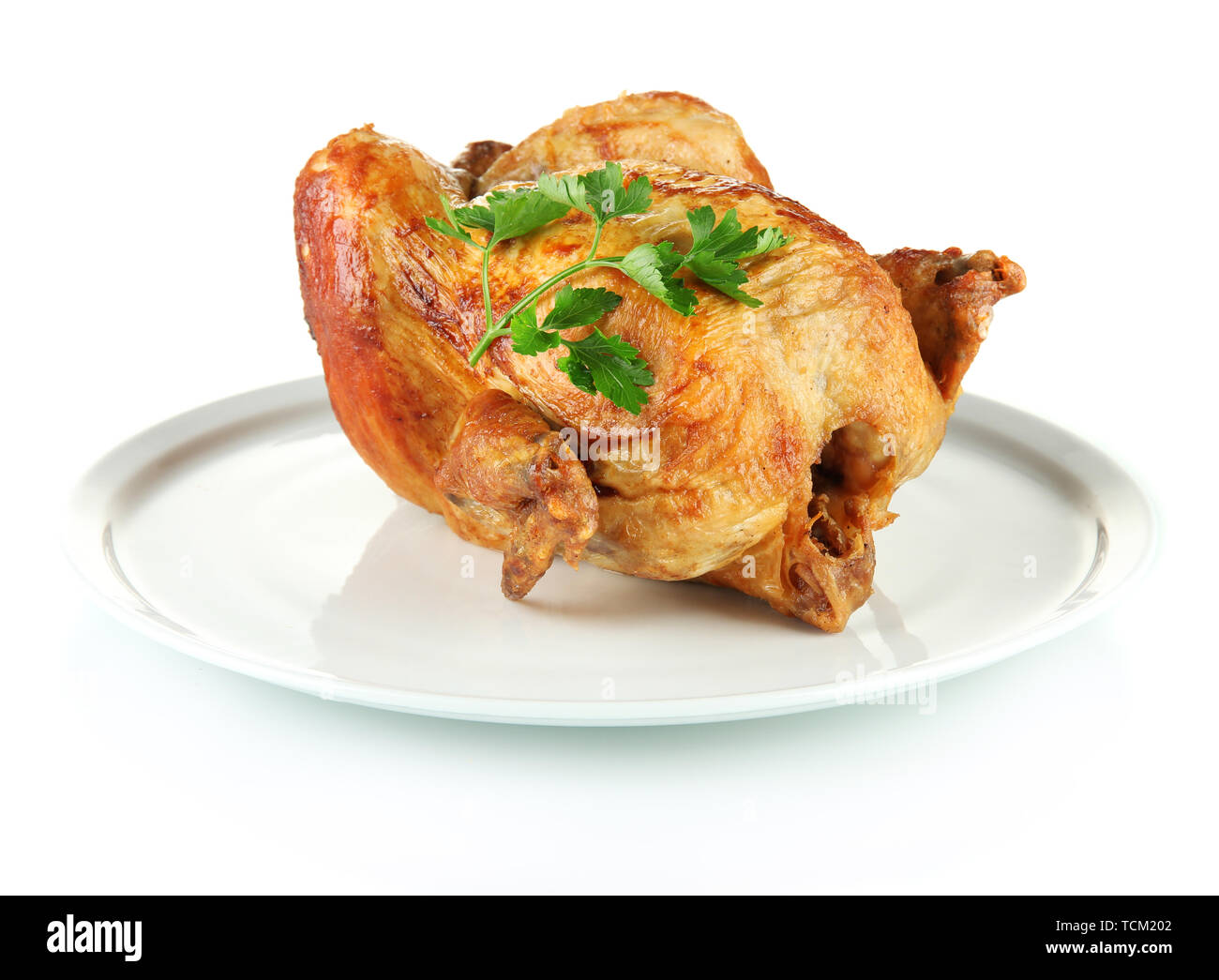 Roasted whole chicken on a white plate isolated on white Stock Photo ...