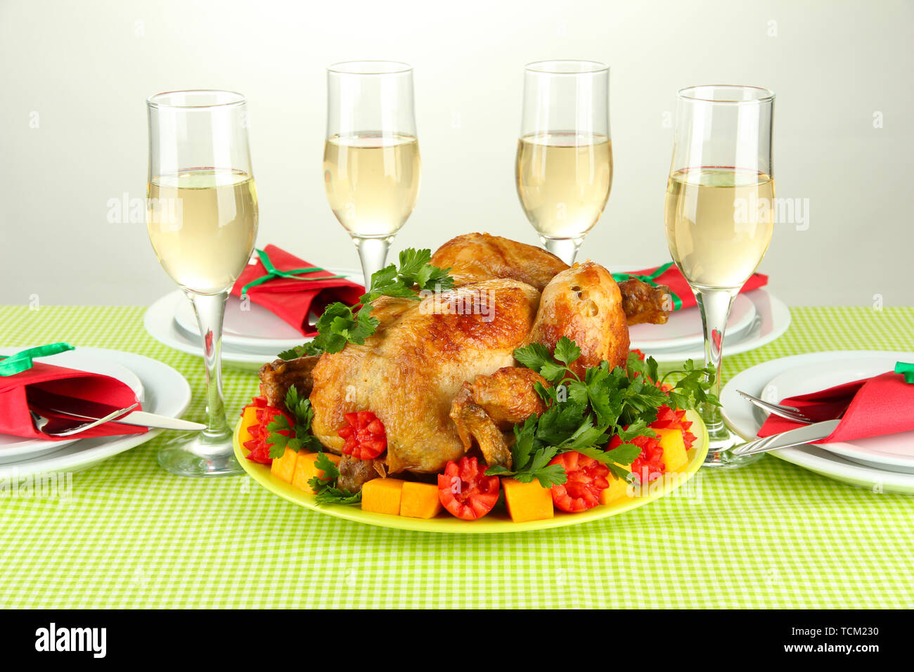 banquet table with roast chicken on white background close-up ...