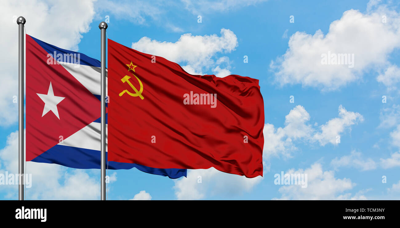 Cuba and Soviet Union flag waving in the wind against white cloudy blue ...