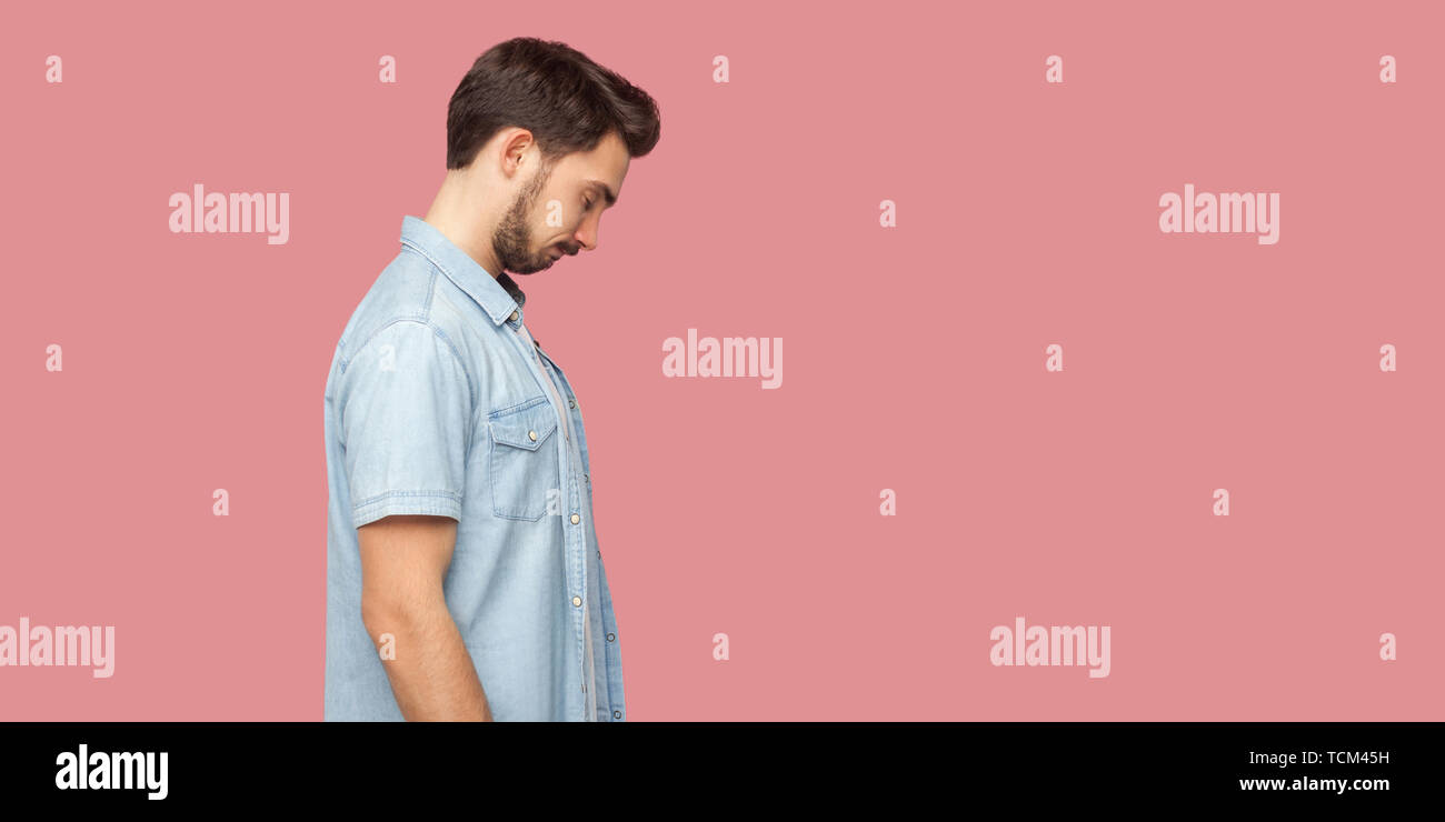 Profile side view portrait of sad alone or confused handsome bearded ...