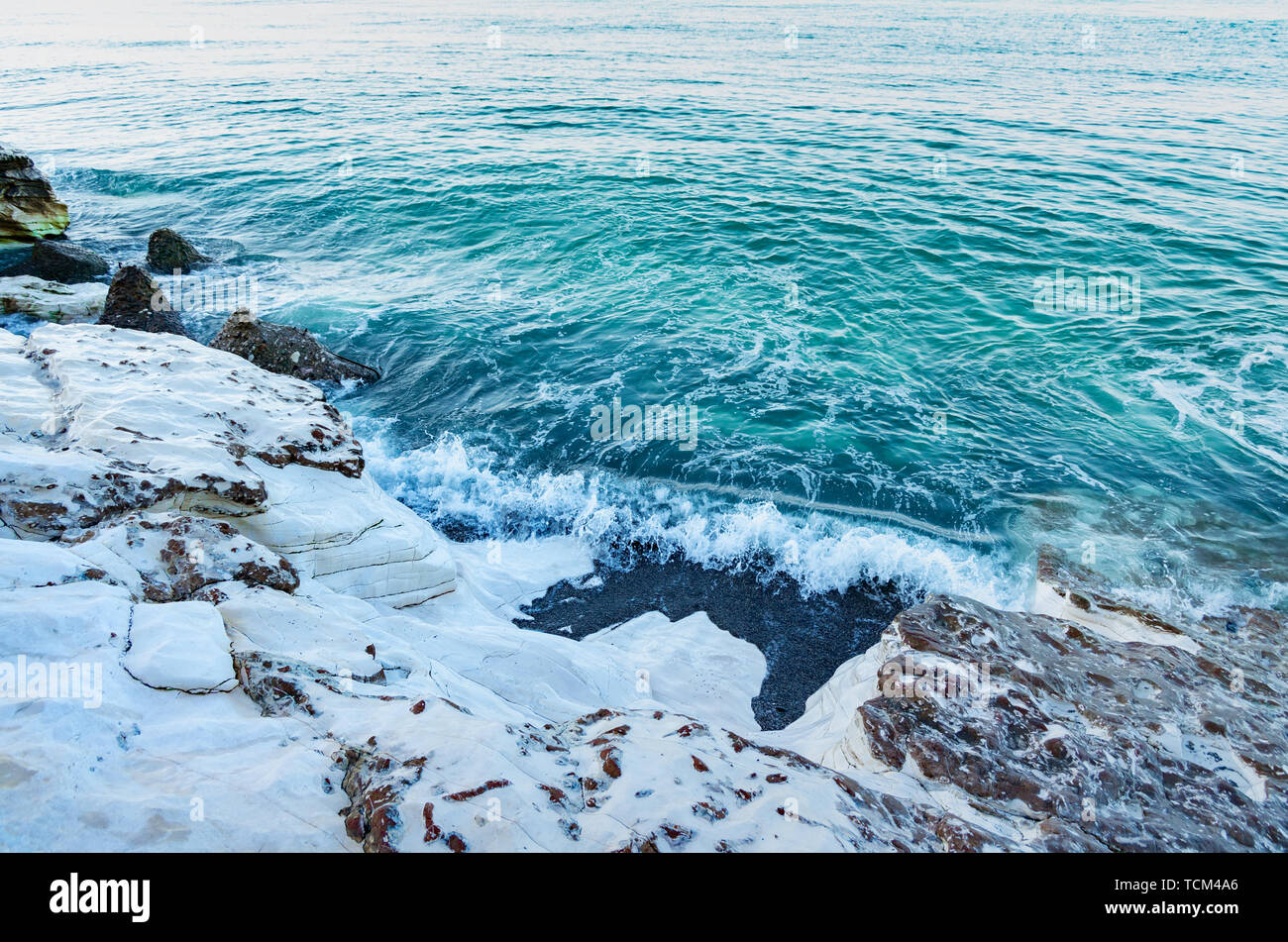 Sea sand cliffs waves surf mountains hi-res stock photography and ...