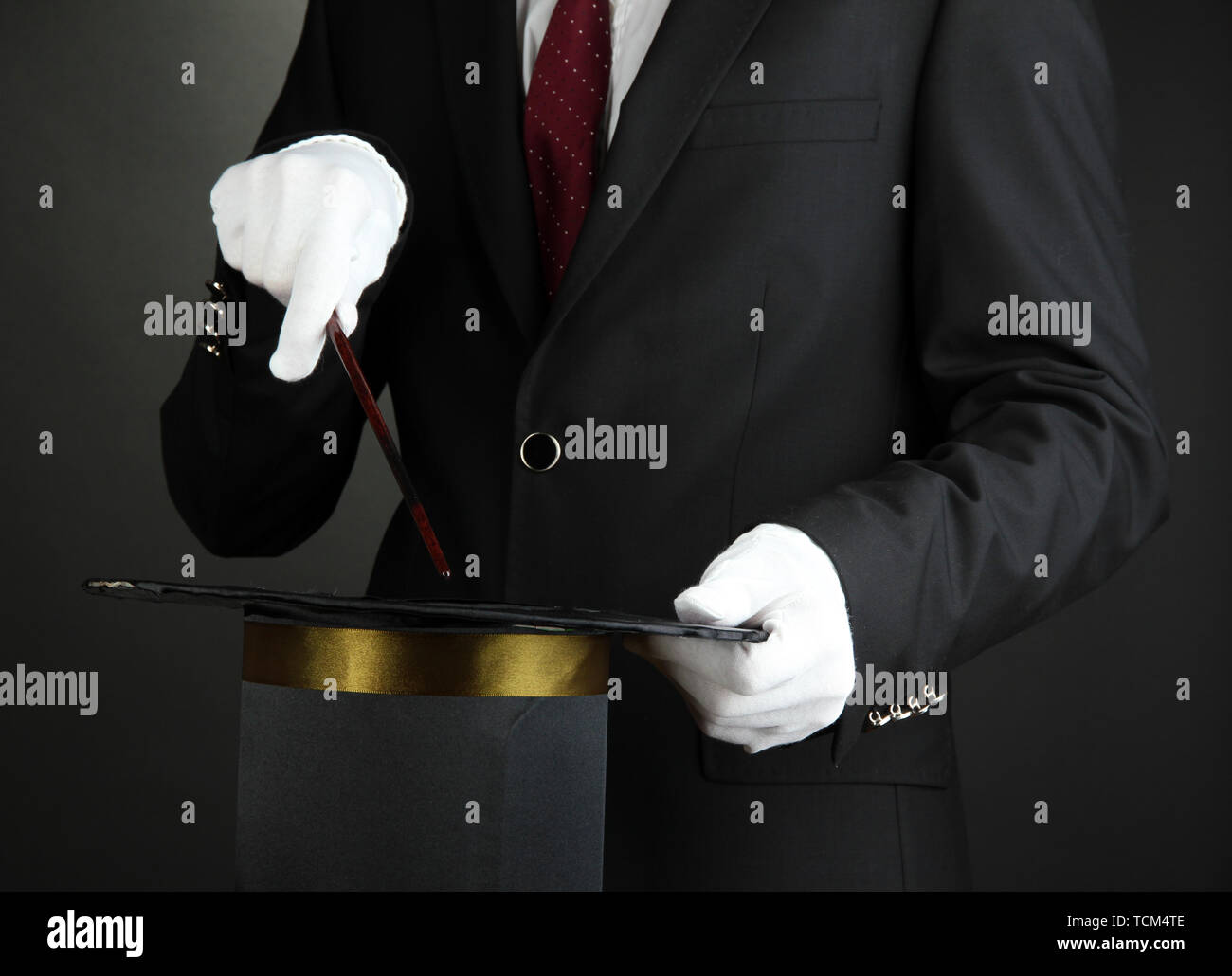 magician performance on dark background Stock Photo - Alamy