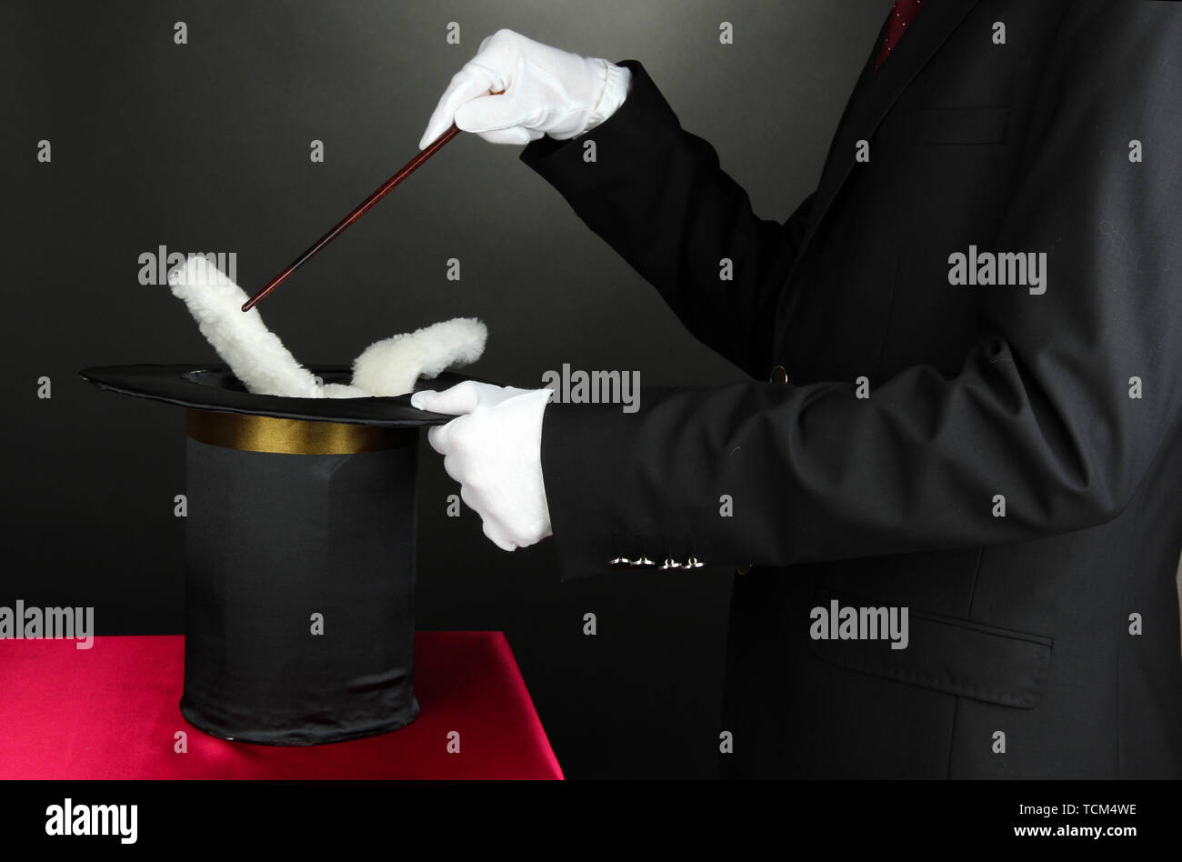 magician performance on dark background Stock Photo - Alamy