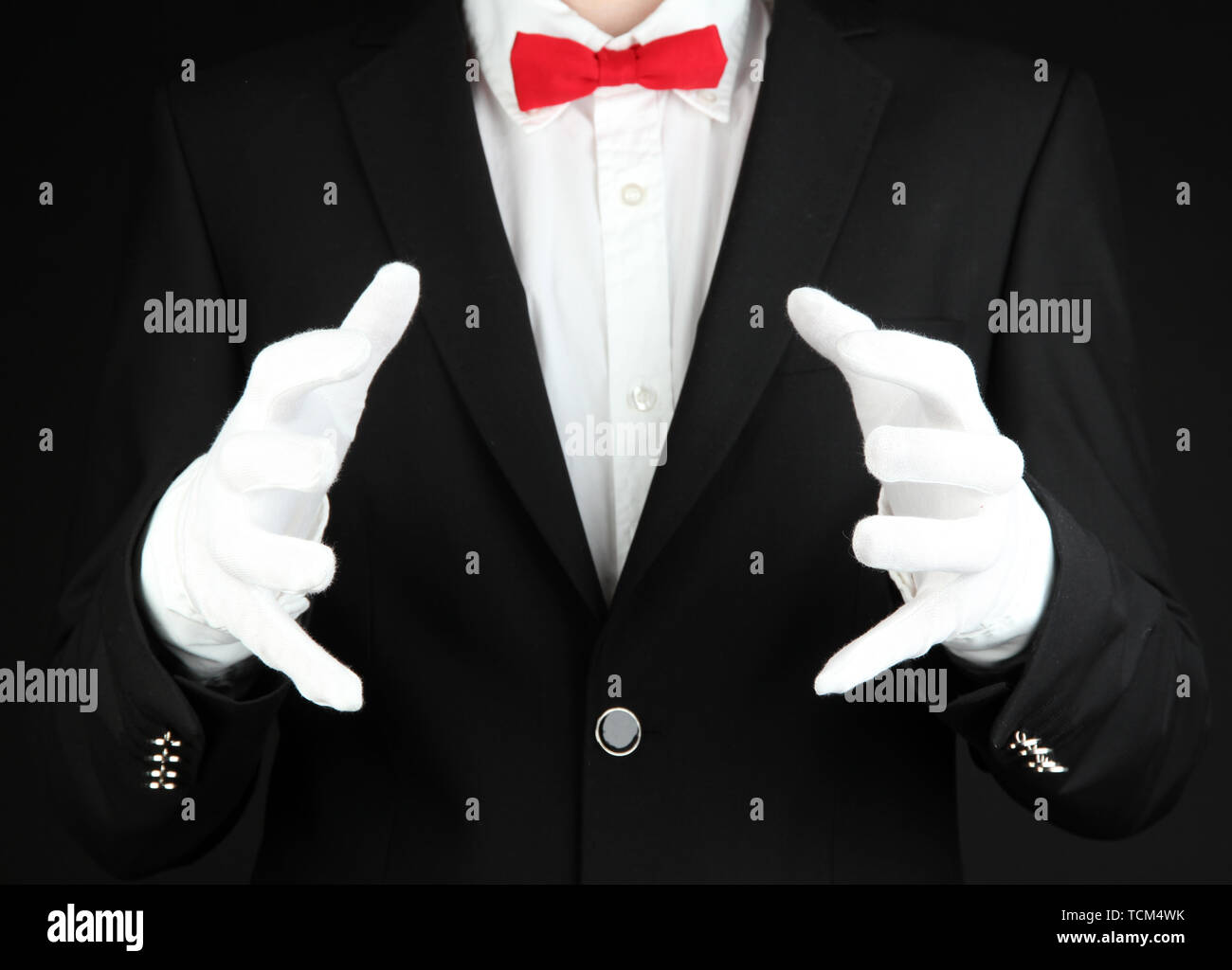 magician performance on dark background Stock Photo - Alamy
