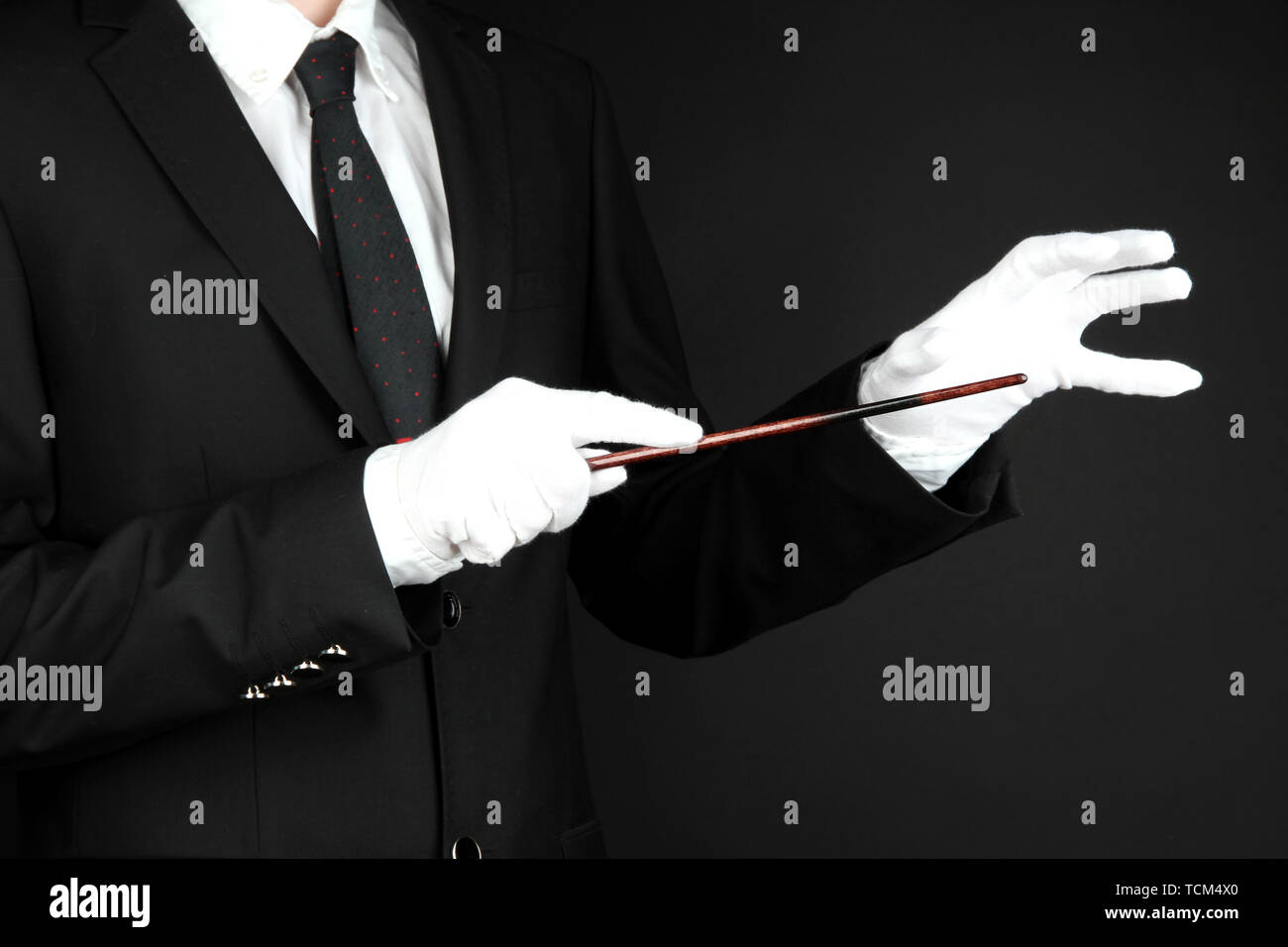 magician performance on dark background Stock Photo - Alamy