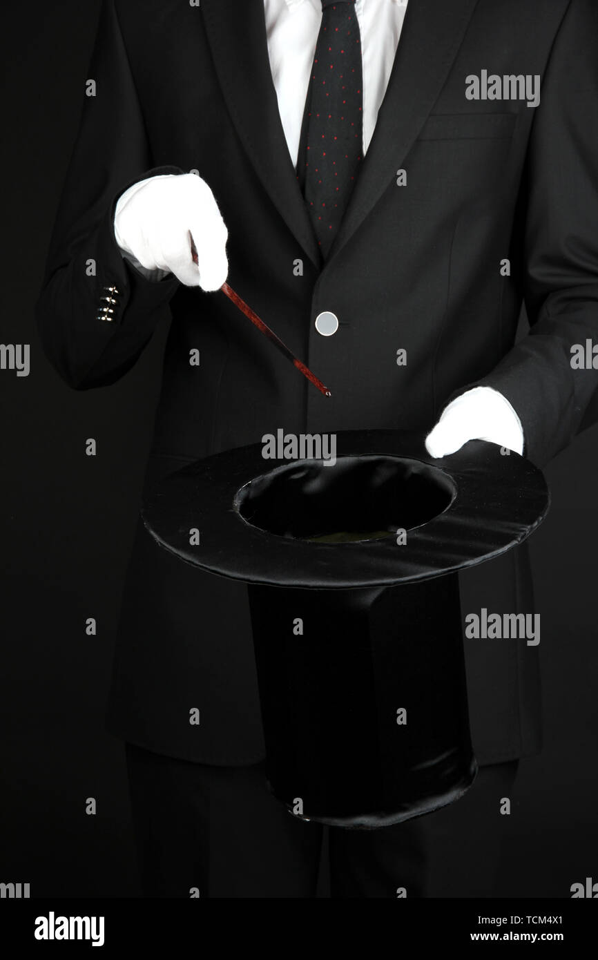 magician performance on dark background Stock Photo - Alamy