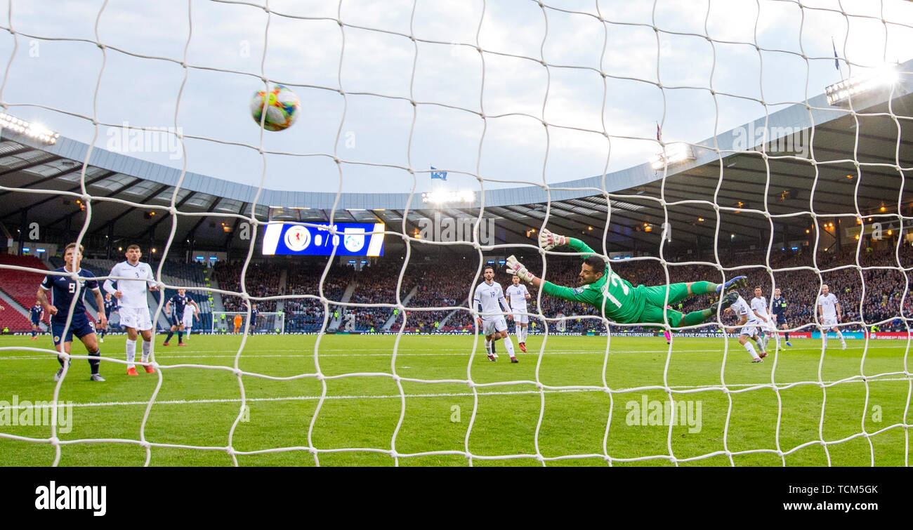 Scotland's Andy Robertson (second right) scores his side's first goal ...