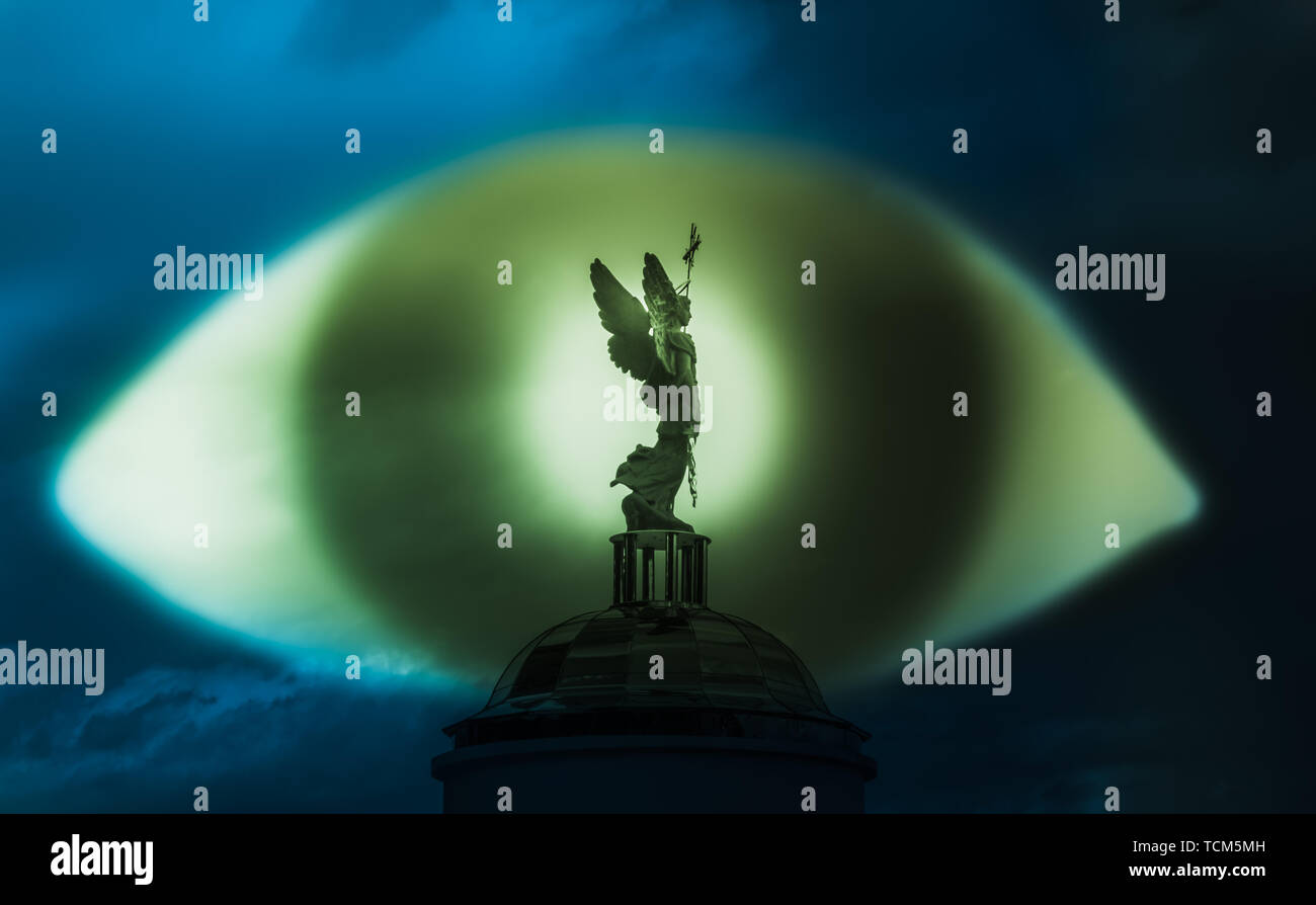 Archangel Michael sculpture against the dark night sky like eye, side ...