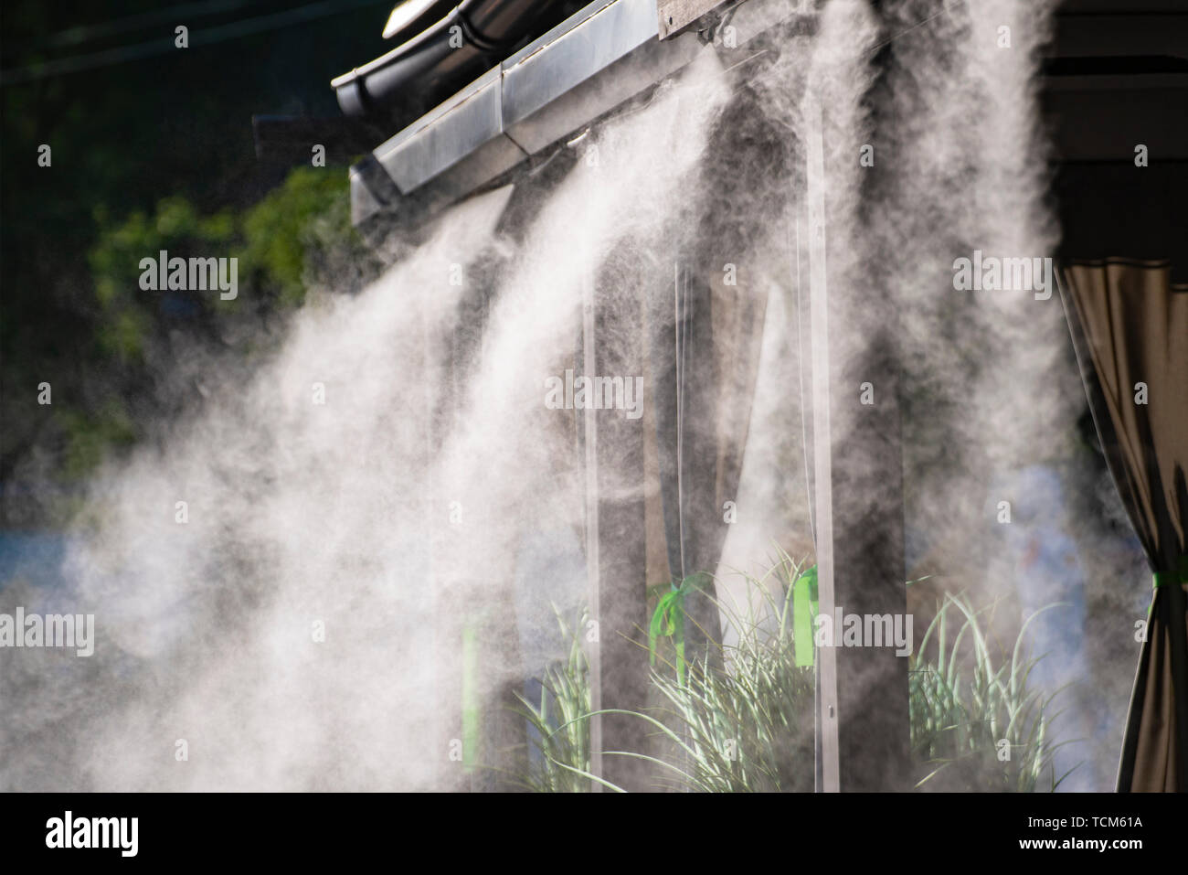 water spray system for cooling in a public cafe at the boiling hot ...