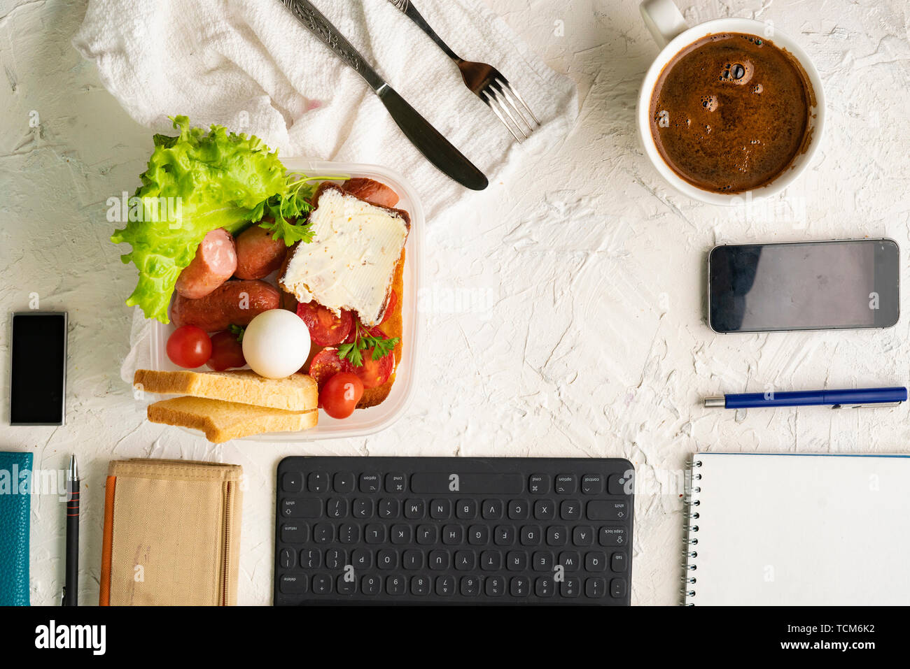 top view of the office work place with computer or laptop pen and phone ...