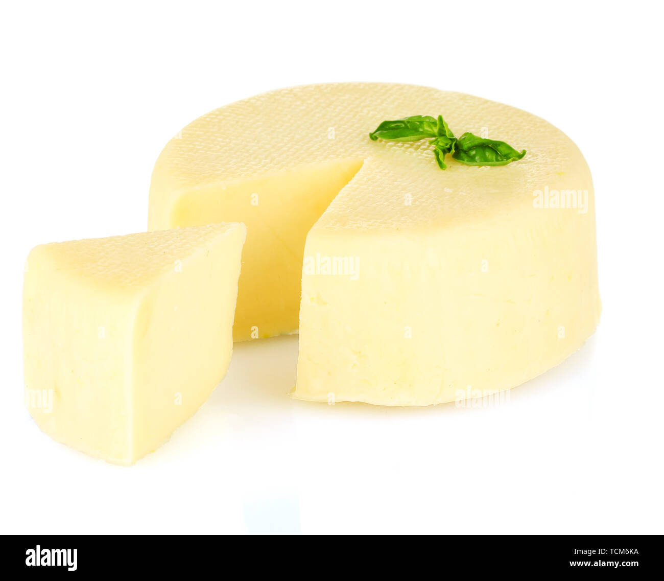 sliced mozzarella cheese with green basil isolated on white Stock Photo ...